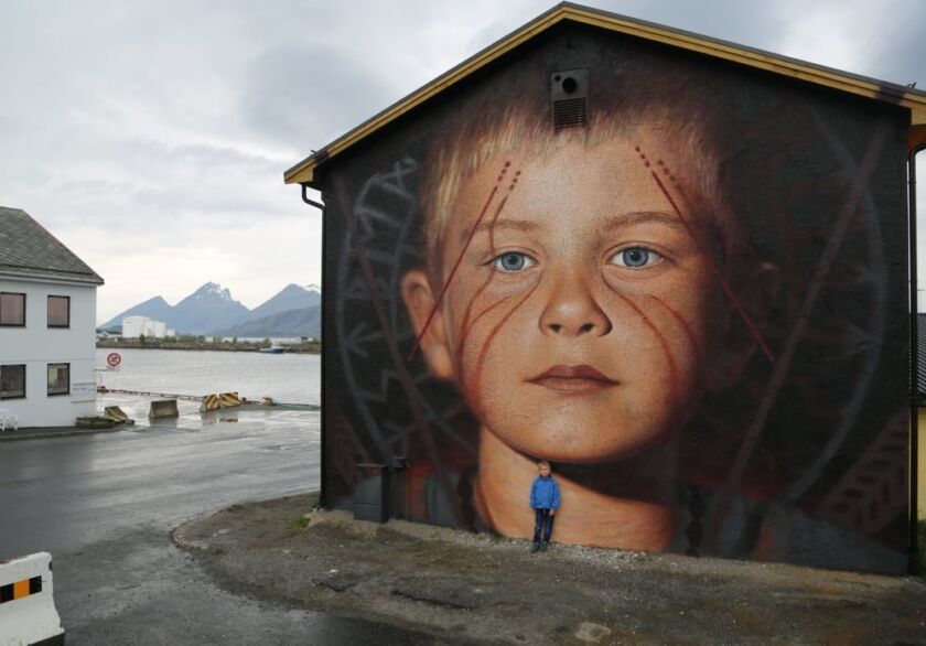 Jorit Agoch: hyper-realistic portrait murals on city walls