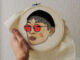 Expressive embroidered portraits composed of colorful lines and ...