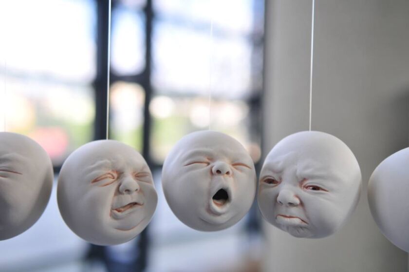 Distorted baby faces: surreal and disturbing ceramic sculptures by ...