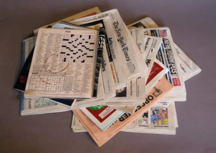 Randall Rosenthal carves humorous hyper-realistic stacks of old ...